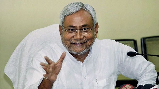 Nitish puts speculations to rest; says working together with NDA 'to ...