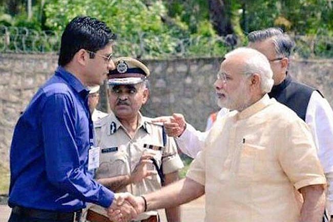 IAS Officer in Soup for Receiving Modi With Sunglasses
