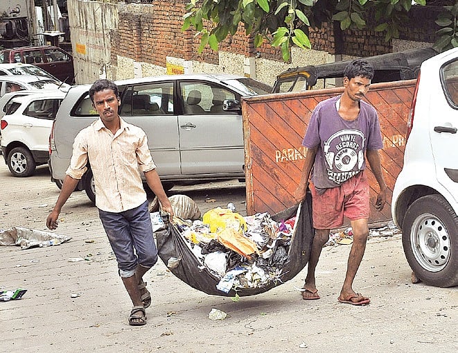 Garbage Piles up Across the City as Sanitation Workers Continue Strike