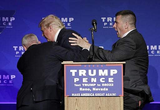 Trump rushed off stage, returns to finish speech