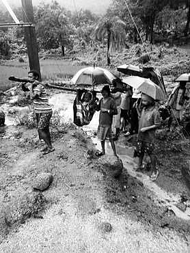 Ailing man carried in sling