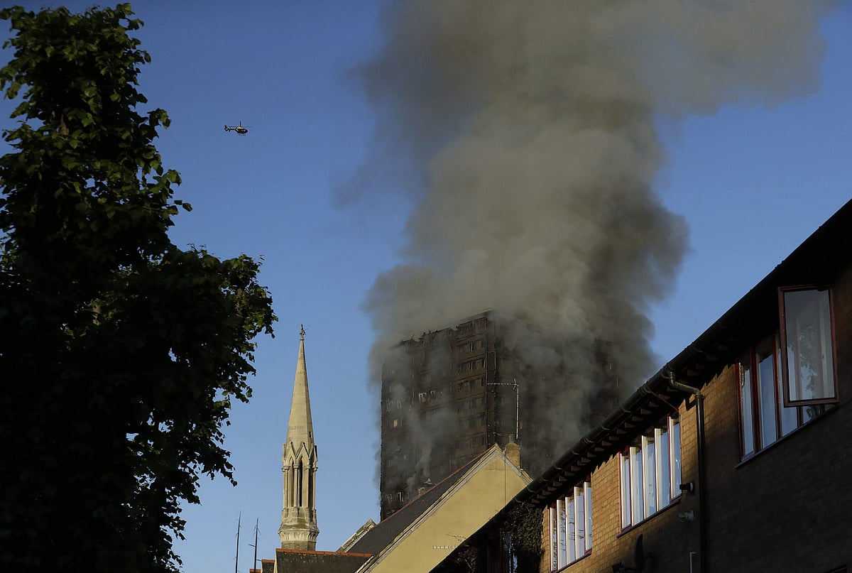 London tower block fire: Flames extinguished, death toll rises to at ...