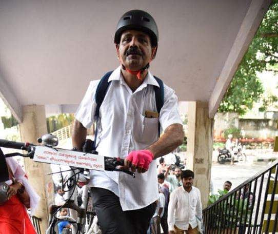 Karnataka babu cycles to work in protest against harassment by senior ...