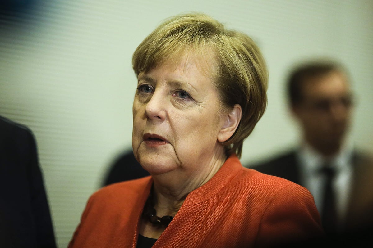 German leftist rebels fight to sink Angela Merkel power pact