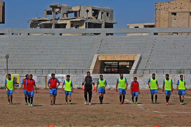 A jail under Islamic State, Syria stadium back to hosting football