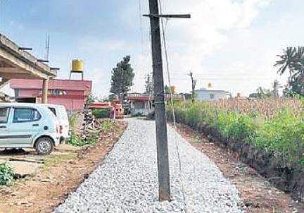 Pole stuck in middle of a new road in Madikeri