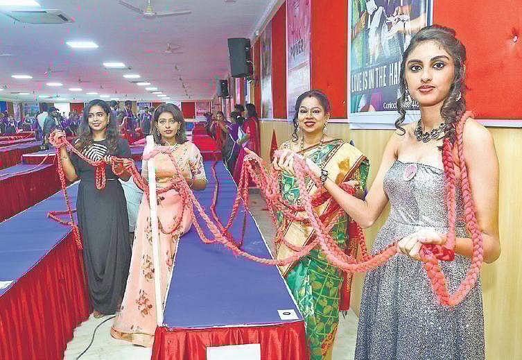 Pink locks of hope sets record, spreads breast cancer awareness