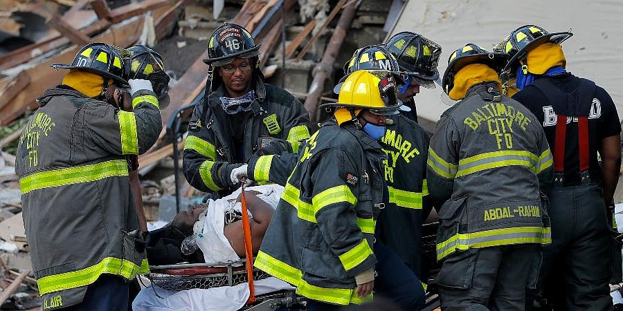 One dead, seven rescued after gas explosion levels Baltimore homes