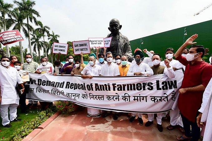 Congress MPs protest inside Parliament complex, demand repeal of new ...