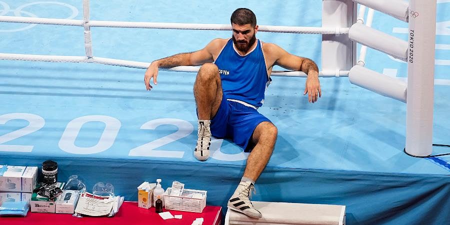 French boxer Mourad Aliev sits on ring apron in protest after DQ loss