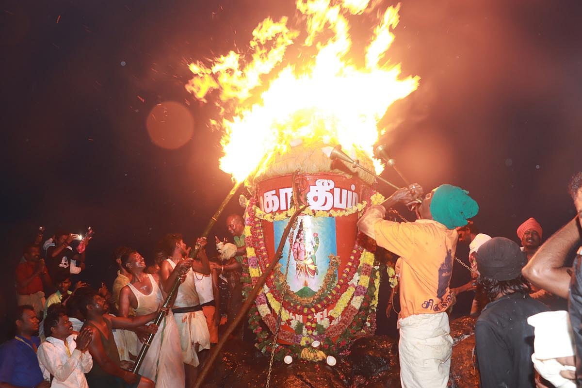 Devotees carry 300 kg ghee atop Velli Malai hills in Madurai to light ...