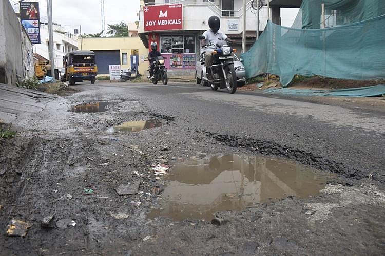 Motorists wary of damaged roads, fear puddles may cause accidents in ...