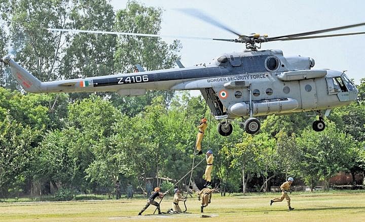 Police commandos conduct helicopter slithering exercise