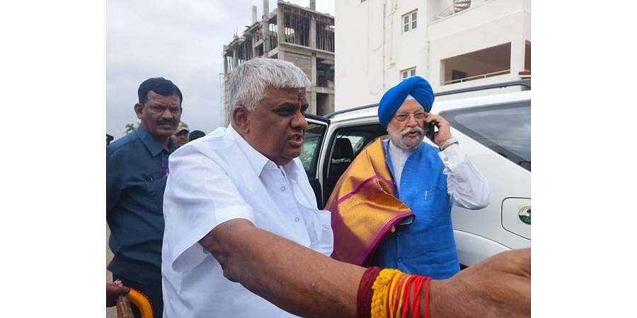 Hardeep Puri gets taste of Hassan politics; Gowda’s son stops his ...