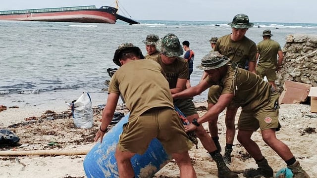 Cargo ship spills oil after running aground in northern Philippines