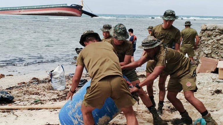 Cargo ship spills oil after running aground in northern Philippines