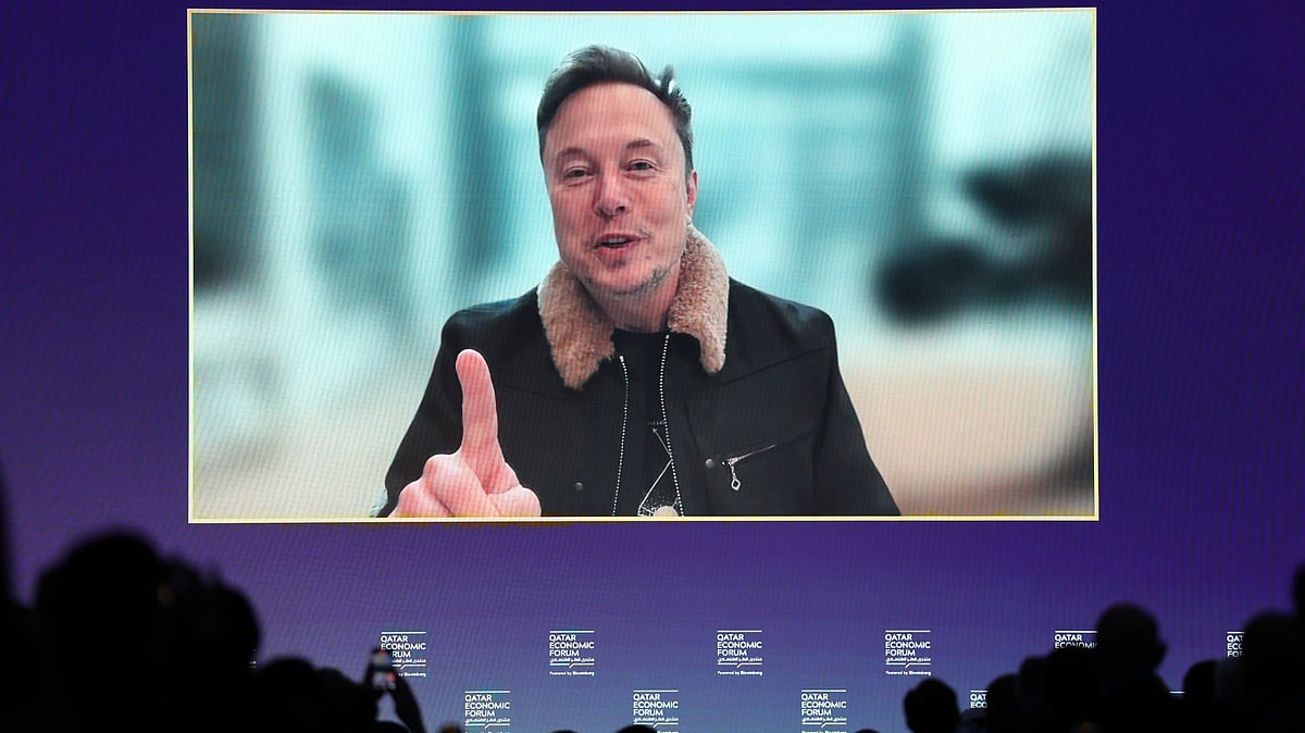 Elon Musk sticks with Tesla, plans to curb political cash