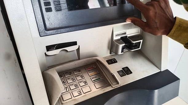 Case booked against two for loading deficient cash in ATM