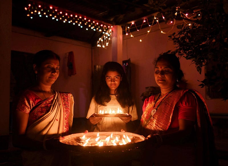 Lights adorn homes as people across India celebrate Diwali with pomp
