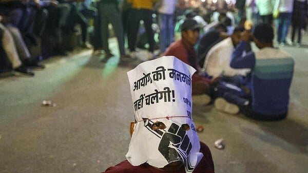 PCS aspirants display creative slogans during ongoing stir in Prayagraj