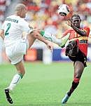 Angola pull Algeria to last eight