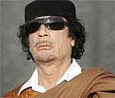 Gaddafi, son buried at night in secret location