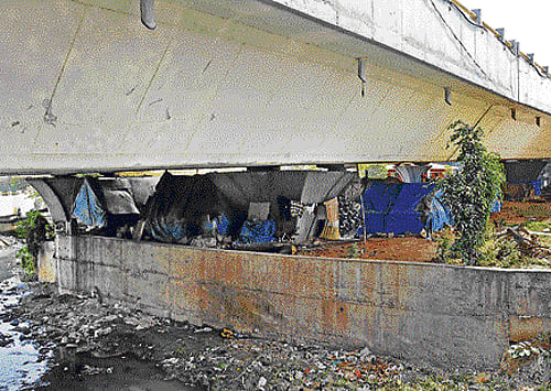 Unsightly slums under flyovers