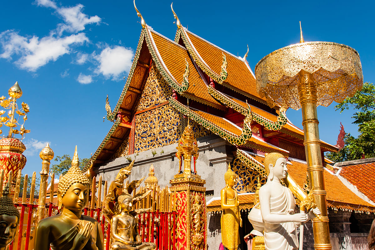 Why do bells at a temple in Thailand sound deeper than their size?