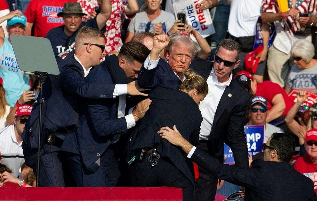 Trump confirma ter sido atingido por uma bala na orelha: "É incrível ...
