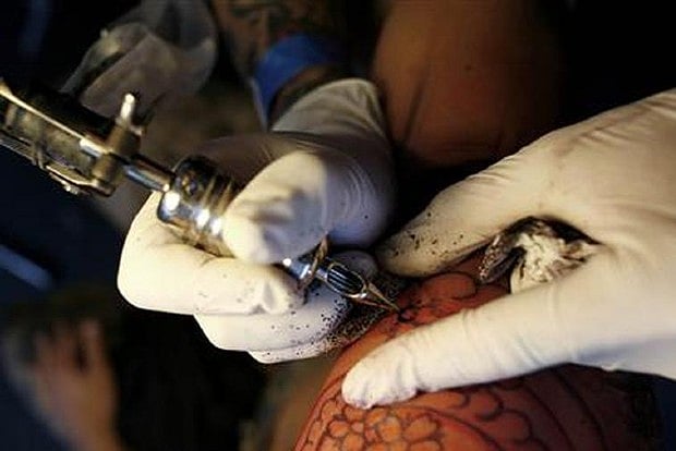 Tattoo ink chemicals that pose cancer threat banned in Europe