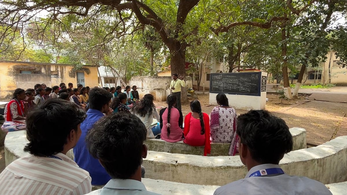 Classroom unsafe, college moves classes under a tree