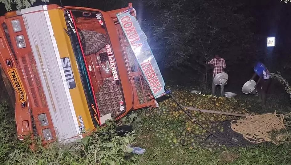 Hit by bus, lorry with mango load overturns in Ambur