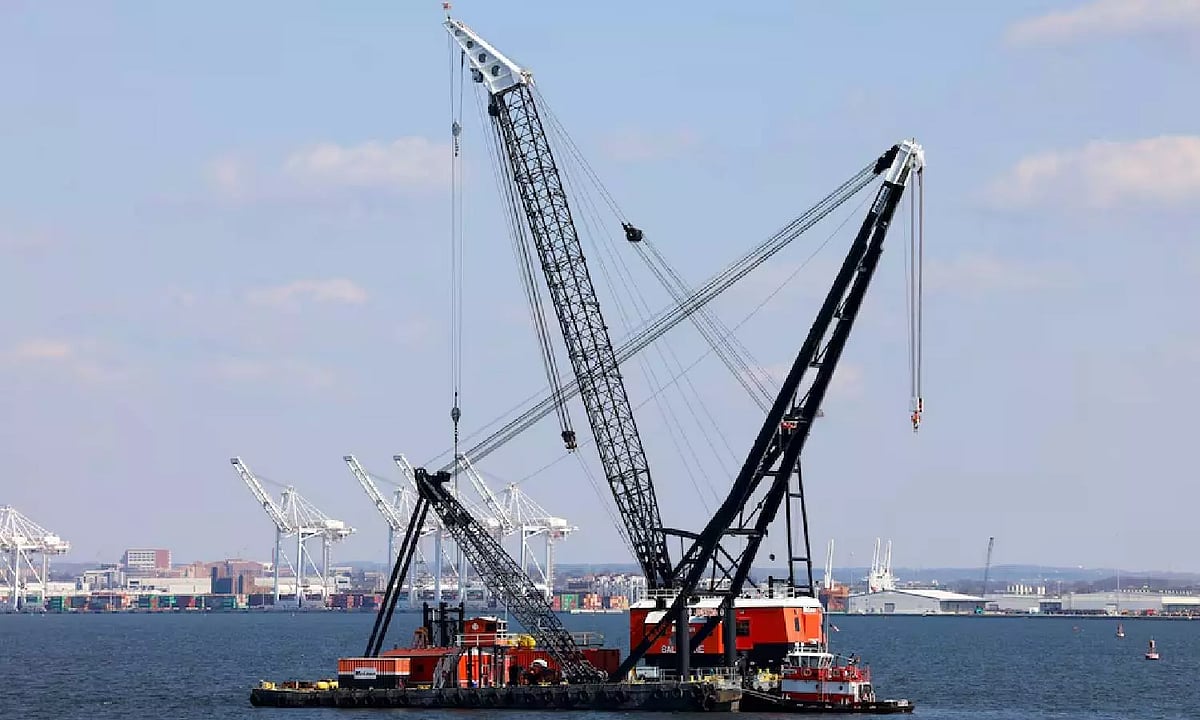 Massive crane put in place to clear Baltimore bridge debris as crews ...