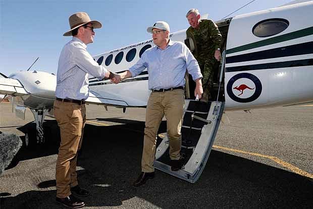 New Australian PM gets to work, government support plummets
