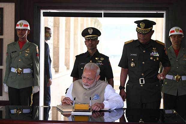 Modi begins Indonesia visit by laying wreath at military cemetery