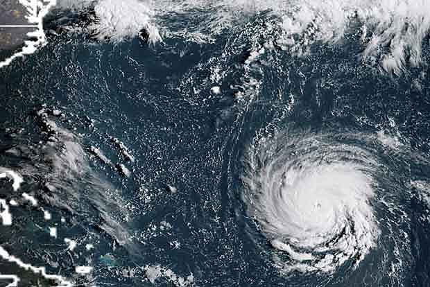 Several dead, hundreds rescued as Hurricane Florence pounds Carolinas