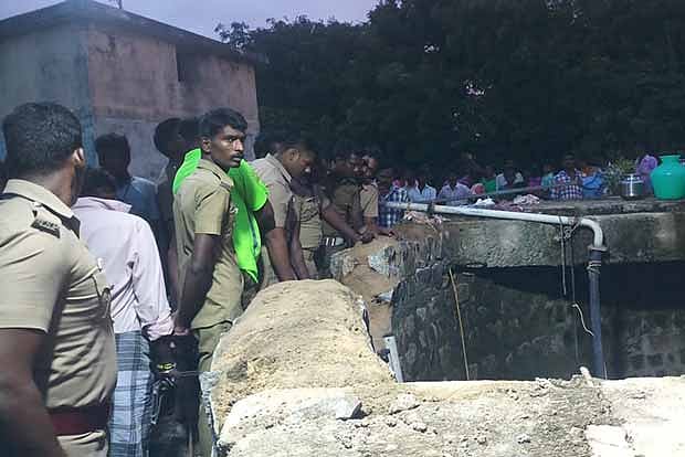 Firemen rescue two farmers stuck in well after saving dog