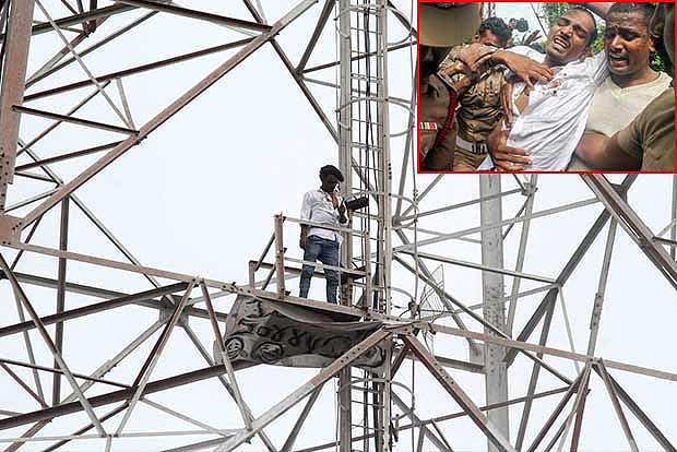 Man held for threatening to jump off mobile tower