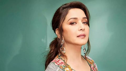 Madhuri Dixit recalls working as a 'junior' to Dharmendra