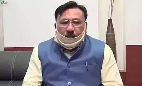 Revenue Minister Jogen Mohan hands over cheques to pattadars in Sivasagar