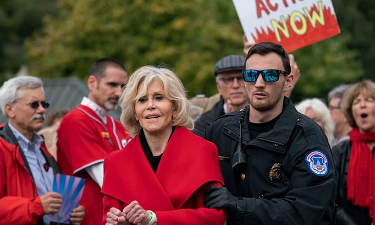 Jane Fonda accepts Bafta award during arrest at climate protest