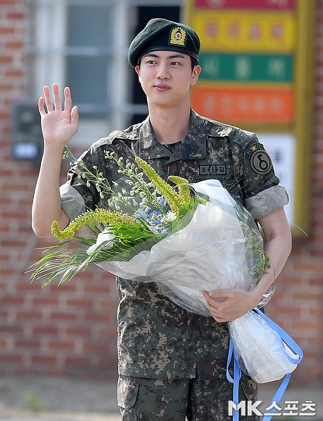 BTS Jin discharged from military, band reunites for his return