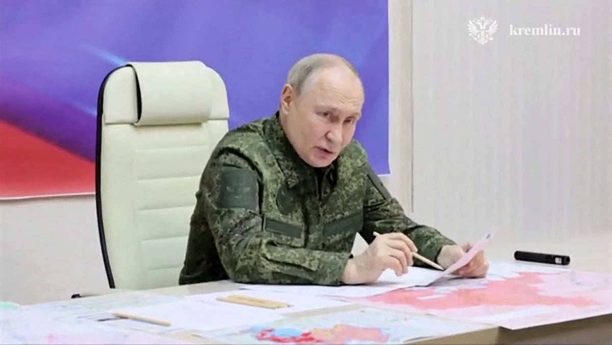 Watch: Putin in rare military uniform visits Kursk
