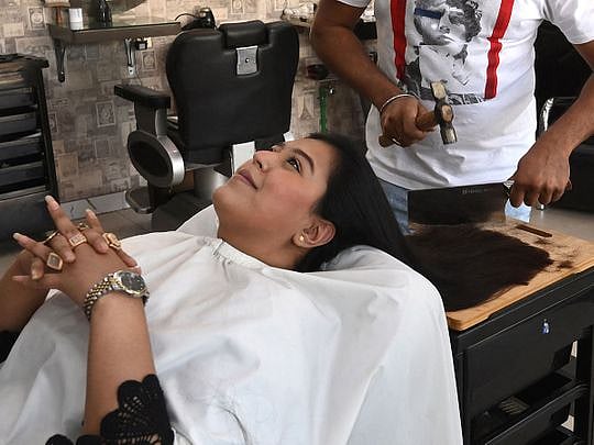 In photos: With cleavers and blowtorches, Pakistan barber offers hair ...