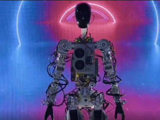 Tesla shows latest Optimus robot prototype with opposable thumbs