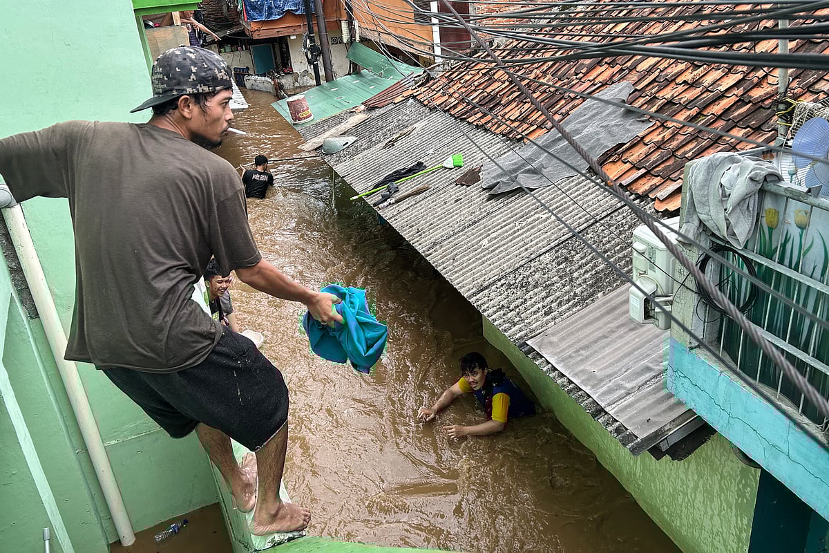 Jakarta floods: Houses submerged, chest-deep waters displace thousands