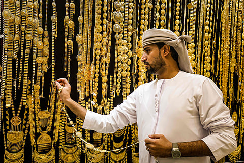 Dubai gold prices steady at Dh547.5 as global bullion dips on Iran ...