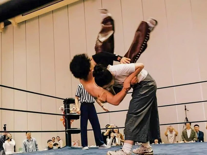 China couple hosts wrestling match at wedding, loser does housework