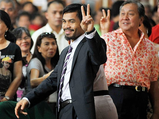 Boxing idol Pacquiao returns, promising to help Philippines