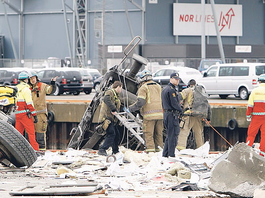 Three killed as runaway train carriages crash into building